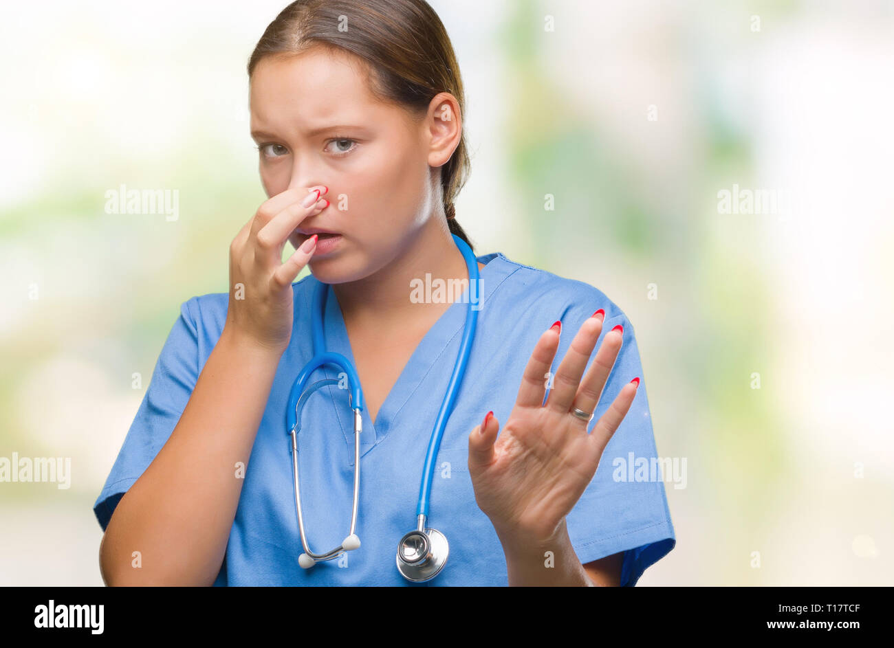 Young caucasian doctor woman wearing medical uniform over isolated ...