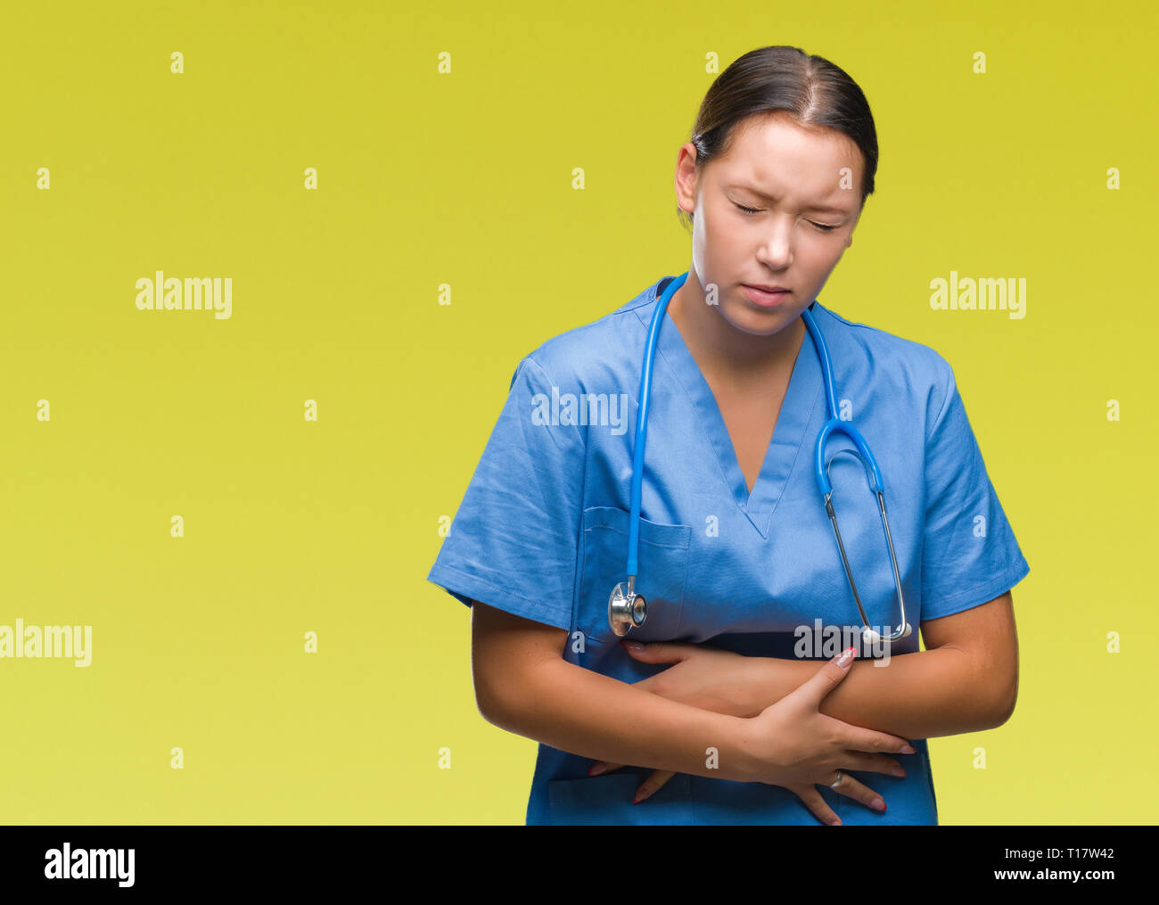 Young caucasian doctor woman wearing medical uniform over isolated ...