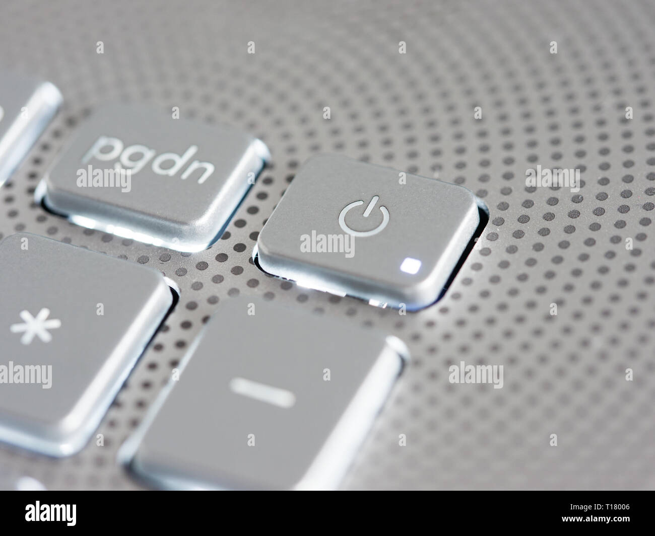 Silver laptop power button close up. Shallow DOF Stock Photo - Alamy