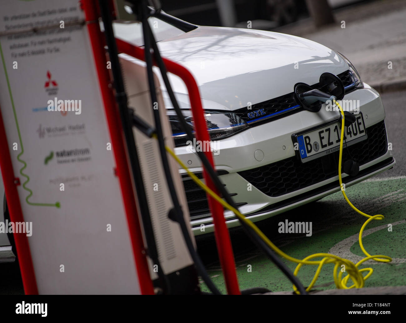 Berlin, Germany. 22nd Mar, 2019. A car is charged at a charging station ...