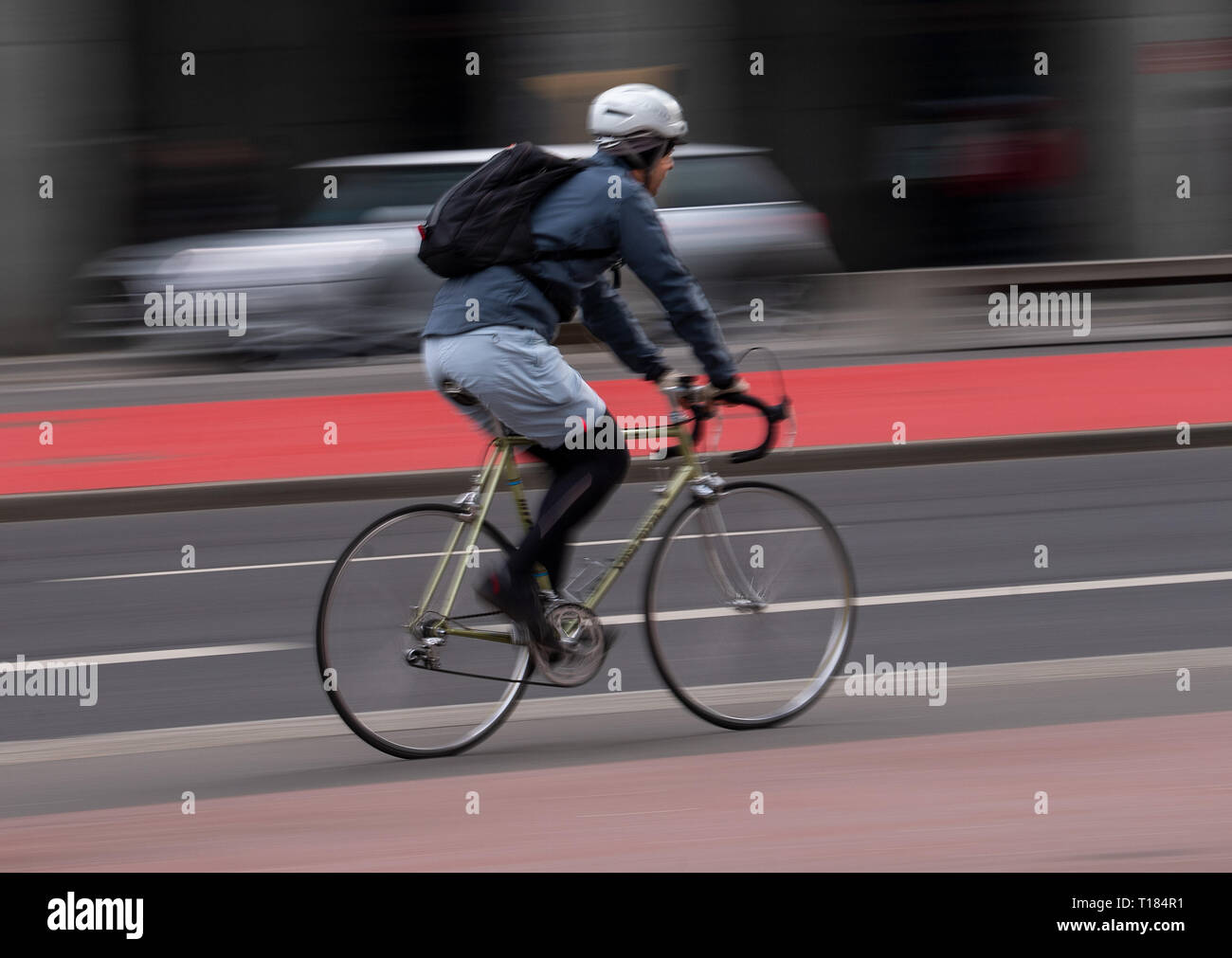 Berlin, Germany. 22nd Mar, 2019. A cyclist rides along a cycle path ...