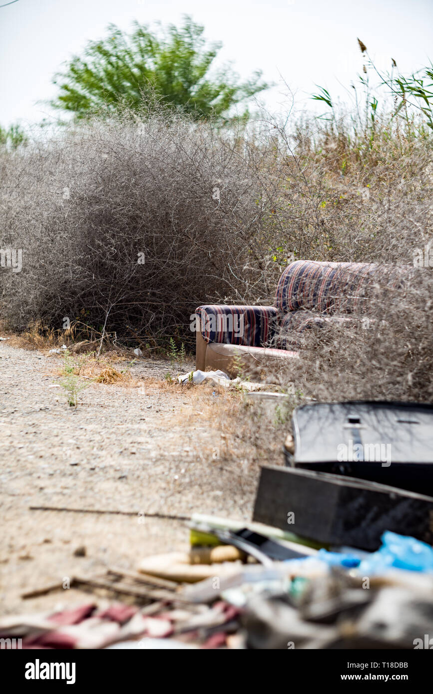 Sofa thrown away in natural area - forest part - illegal dumping trash ...