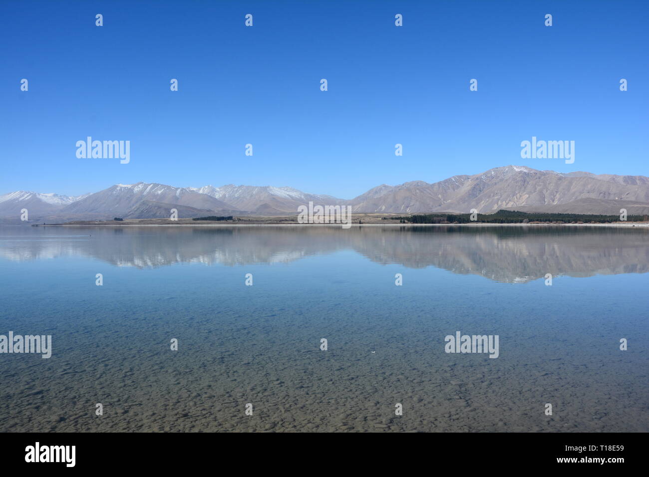 The surface of the lake is like a mirror hi-res stock photography and ...