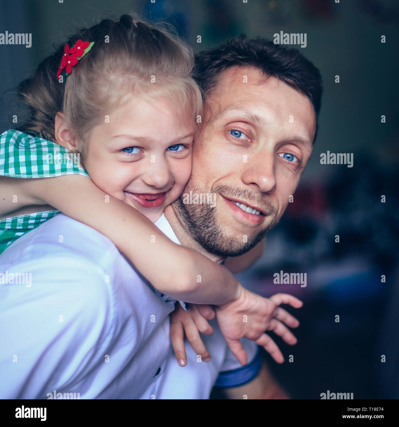 concept of raising children - a little girl hugging her beloved Stock ...