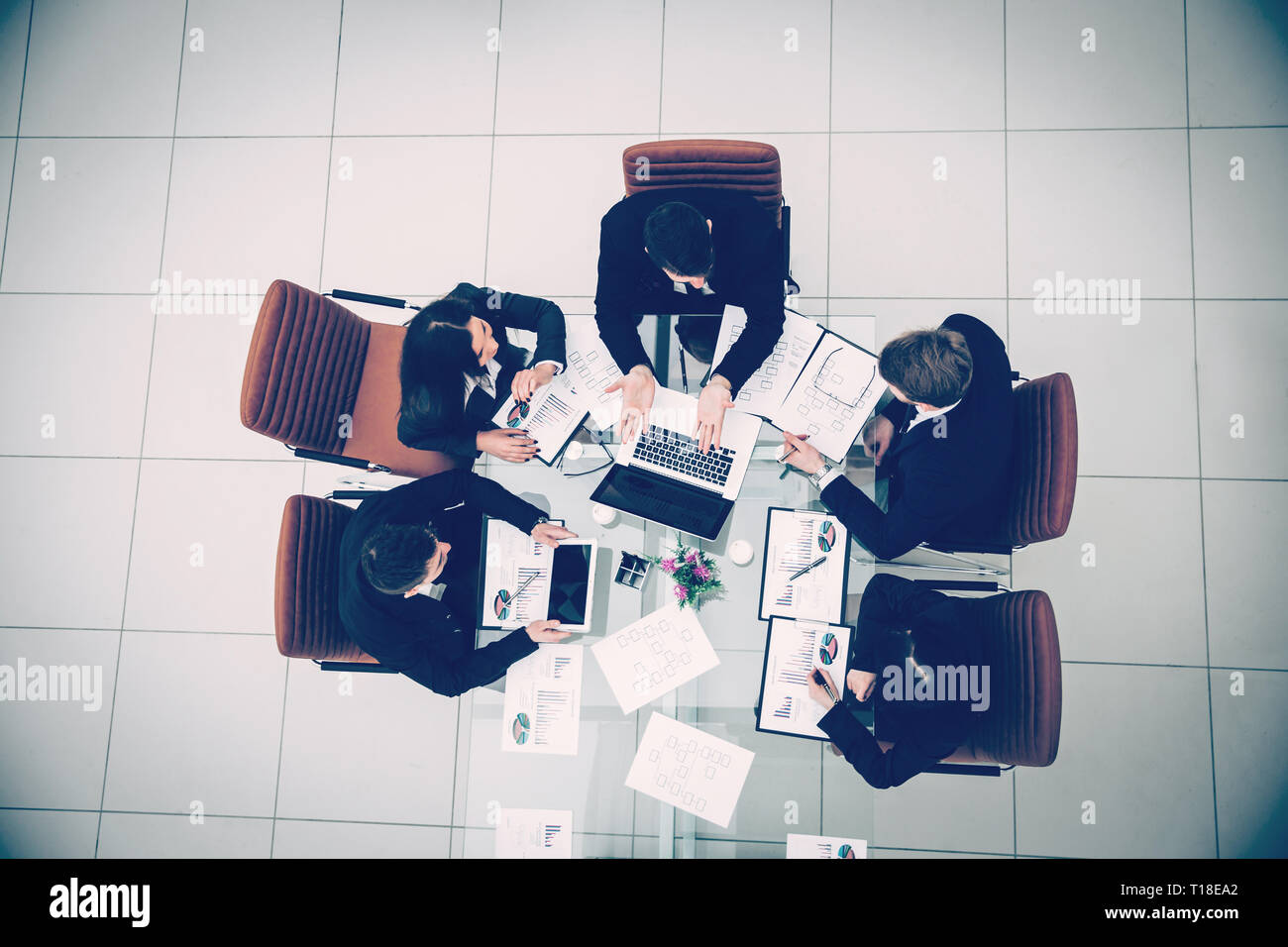 successful business team discussing a new marketing schemes in the ...