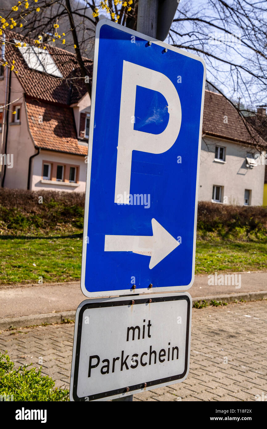 blue parking lot sign with arrow Stock Photo - Alamy