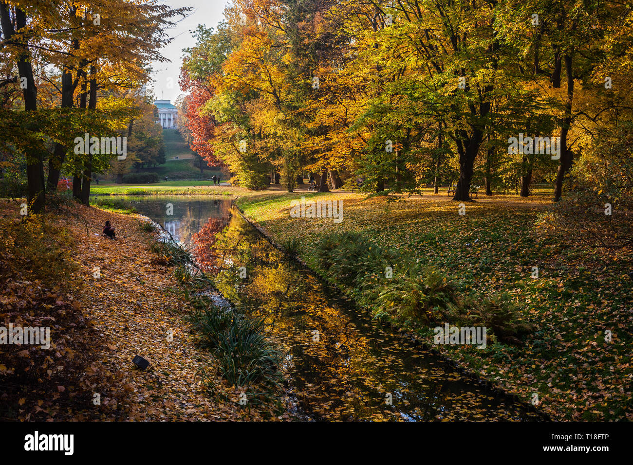 Canal and autumn trees in Royal Lazienki Park in city of Warsaw, Poland ...