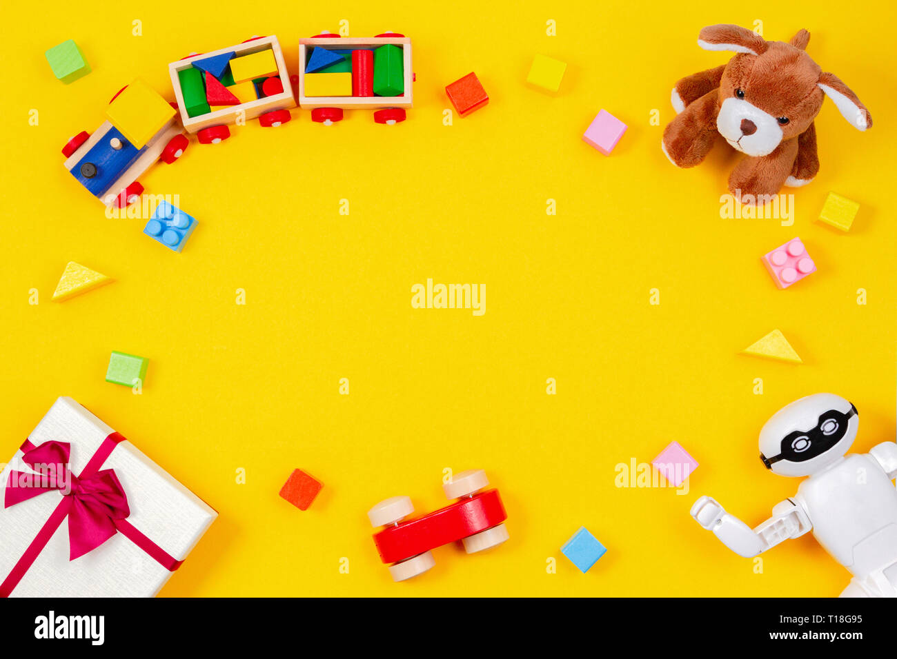 Kids baby toy background. Teddy bear, toy train, present gift box and ...