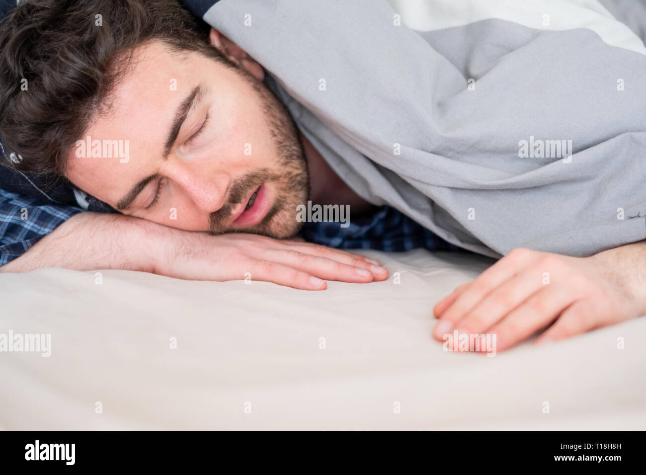 Man sleeping bed hi-res stock photography and images - Alamy