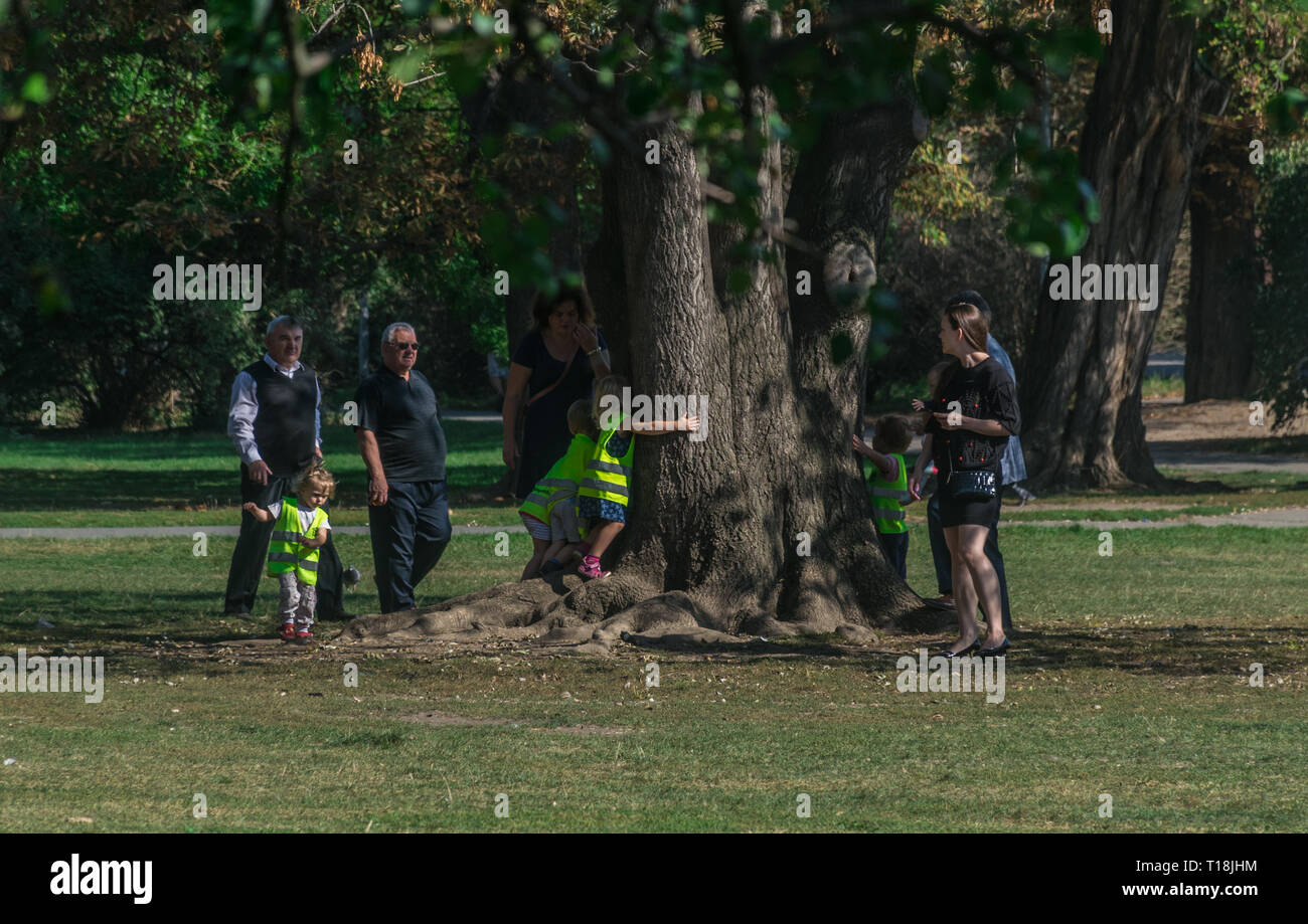 Prague, Czech Republic - September 10, 2019: kids hugging a tree under ...
