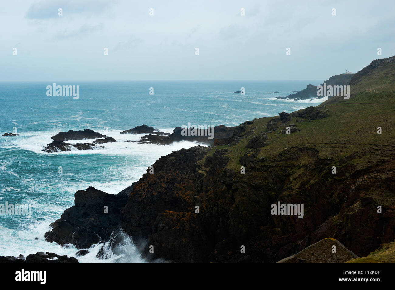 Cornwall, UK. 6th April 2018. Waves crash into a Cornish coastline on a ...