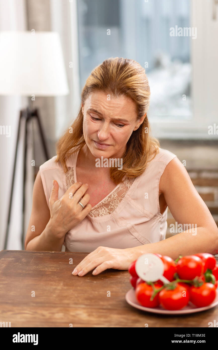 Blond woman with allergy having rash on her body scratching skin Stock ...