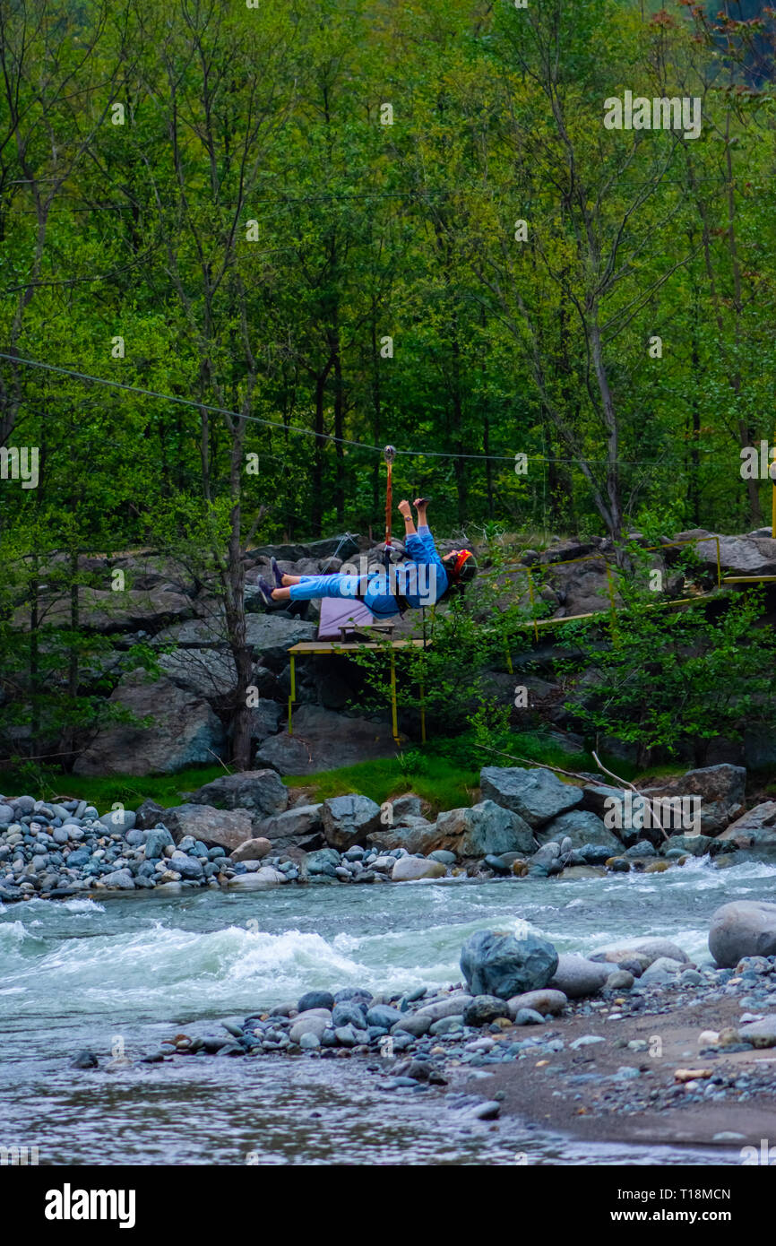 Girl enjoying zip line above the river Firtina in Turkey Stock Photo ...