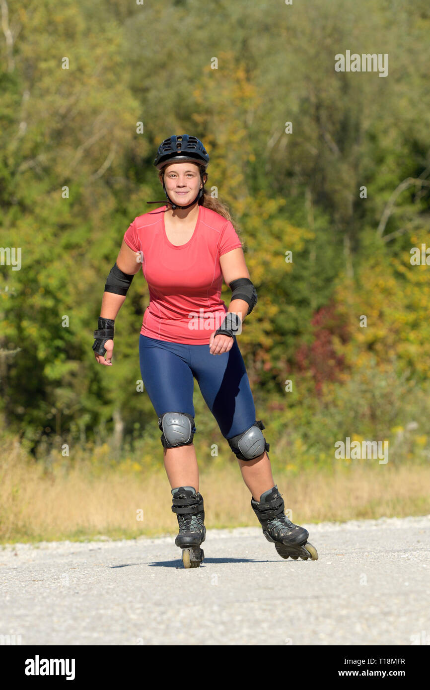 Woman rollerblades rollerblading hi-res stock photography and images ...