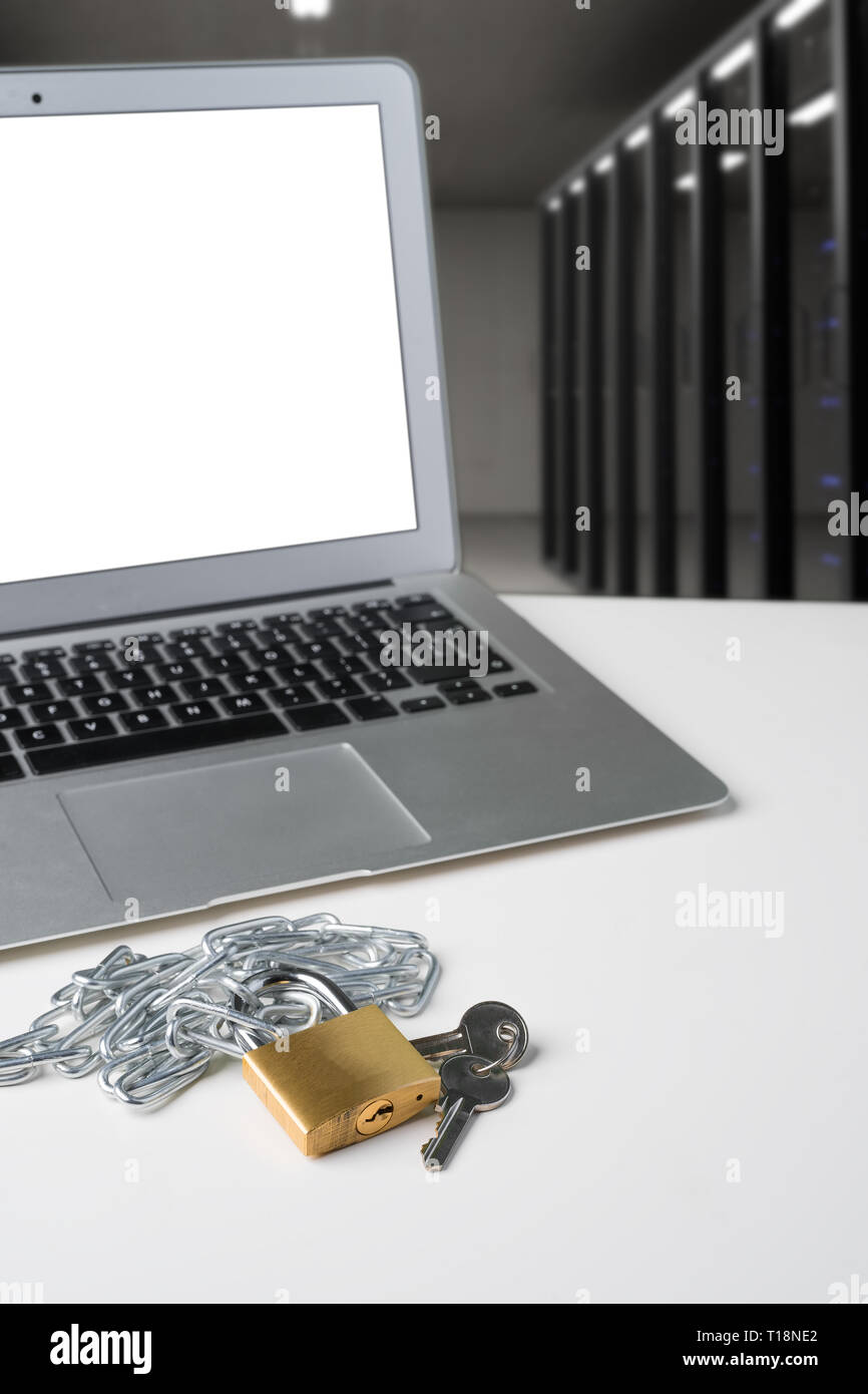 Padlock, chain and keys with laptop computer in a server room or data ...