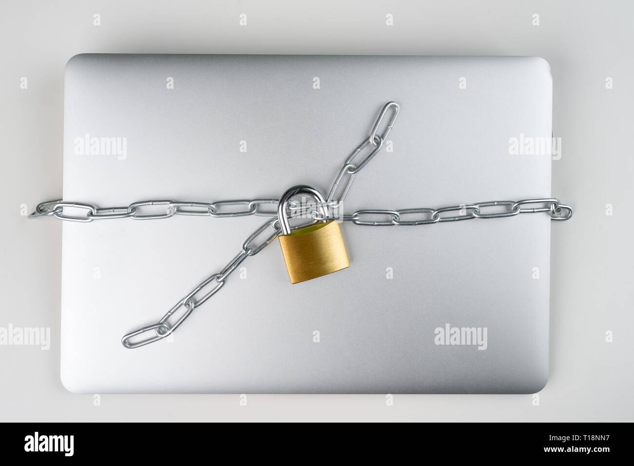 Padlock with chain on a laptop computer. Cyber security abstract ...