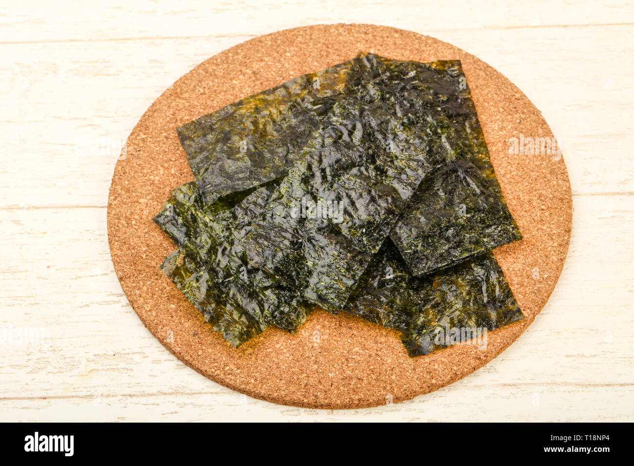 Crispy Nori sheets chips over wooden background Stock Photo - Alamy
