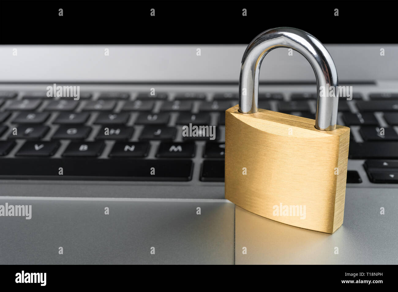 Padlock on a laptop computer keyboard. Cyber security abstract concept ...