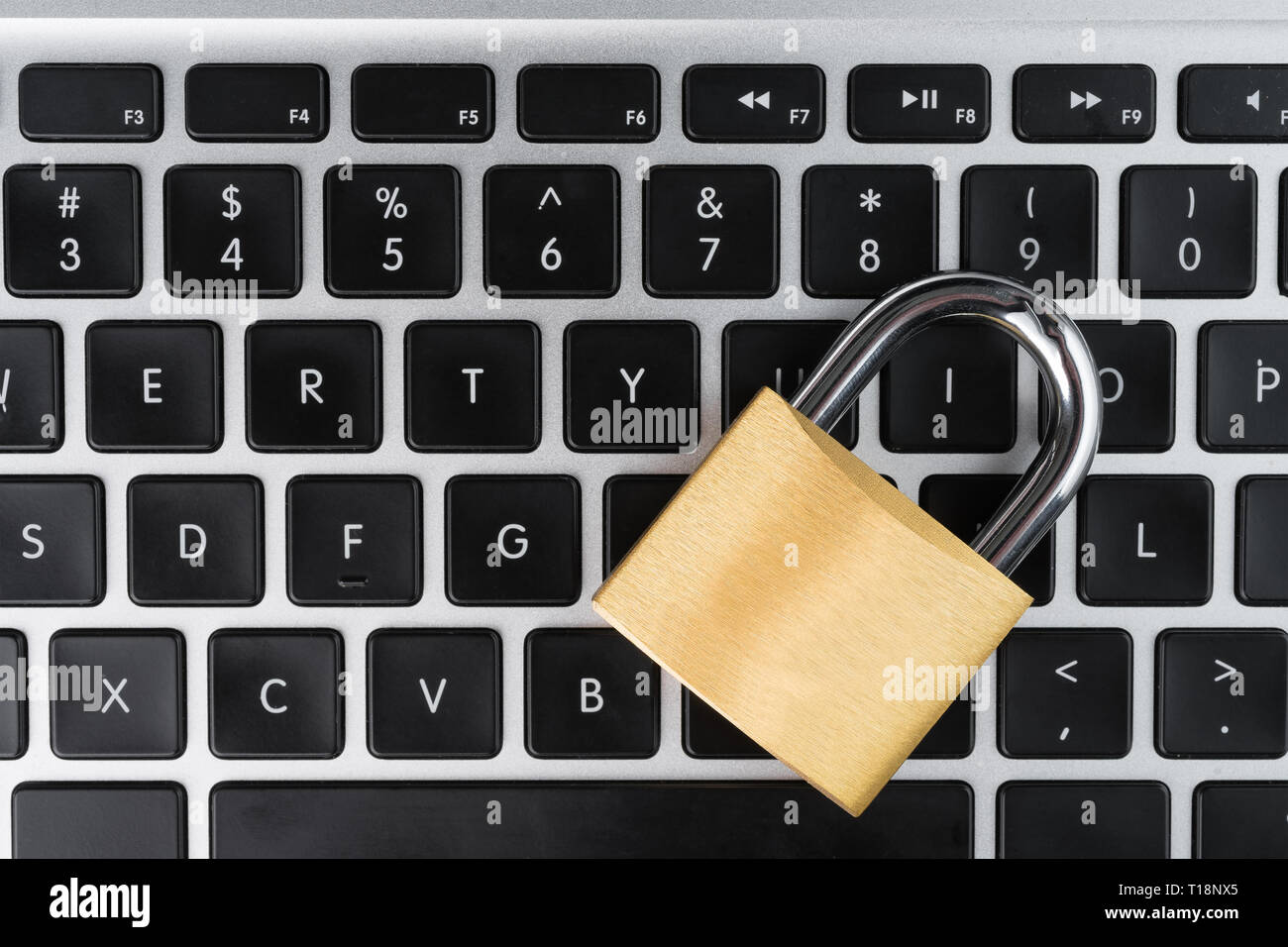 Padlock on a laptop computer keyboard. Cyber security abstract concept ...
