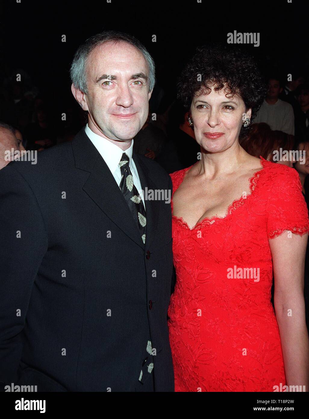 LOS ANGELES, CA. December 16, 1997: Actor JONATHAN PRYCE & wife at the ...