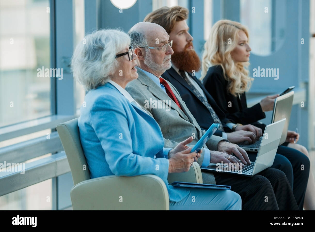 Business group in a meeting watching presentation Stock Photo - Alamy