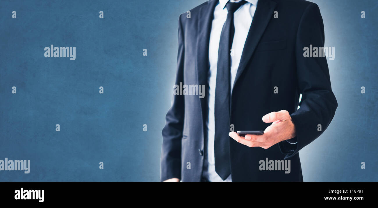 man wearing suit holding mobile phone, businessman using smartphone ...