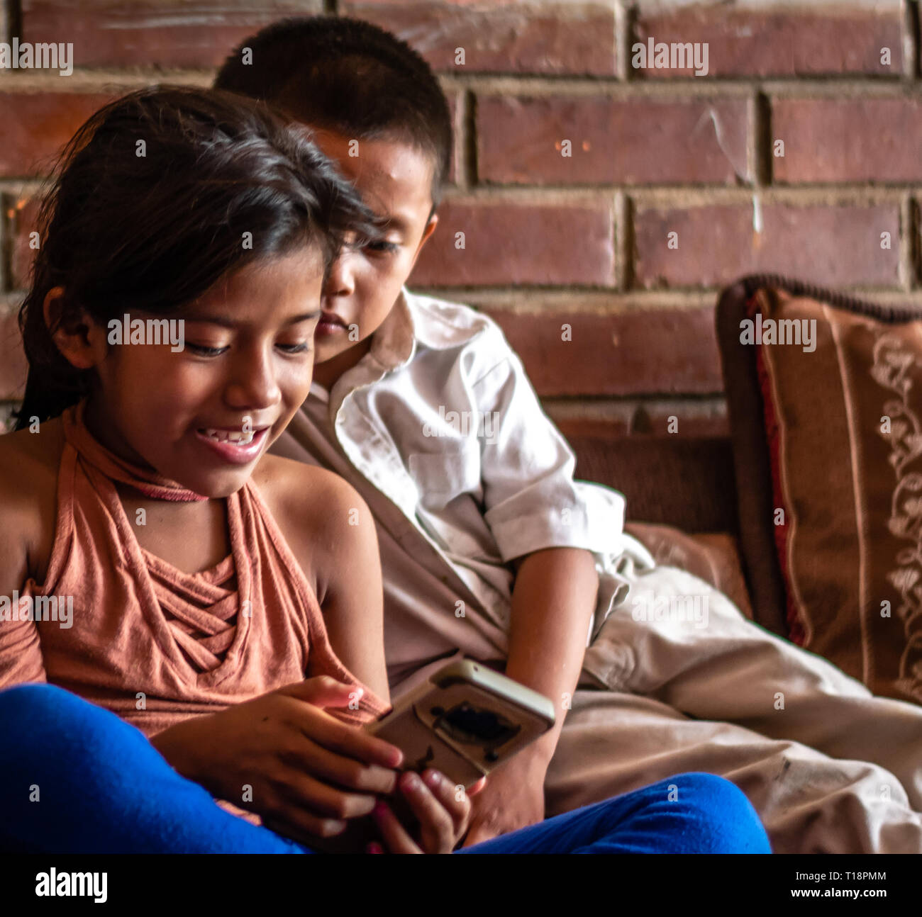 young latin brother and sister facetiming in Guatemala Stock Photo - Alamy
