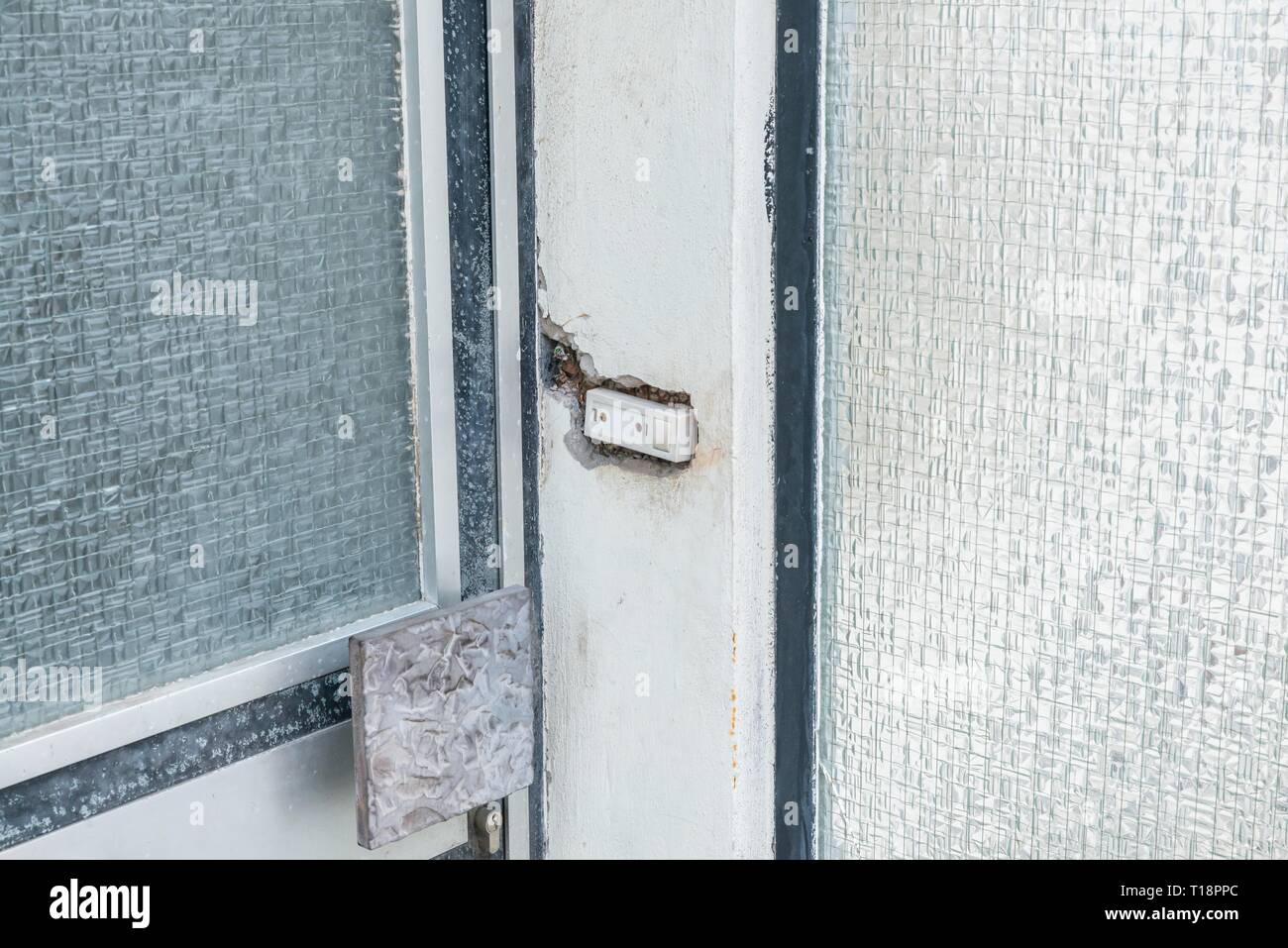 Old broken front door with glass pane and bell, Germany Stock Photo - Alamy