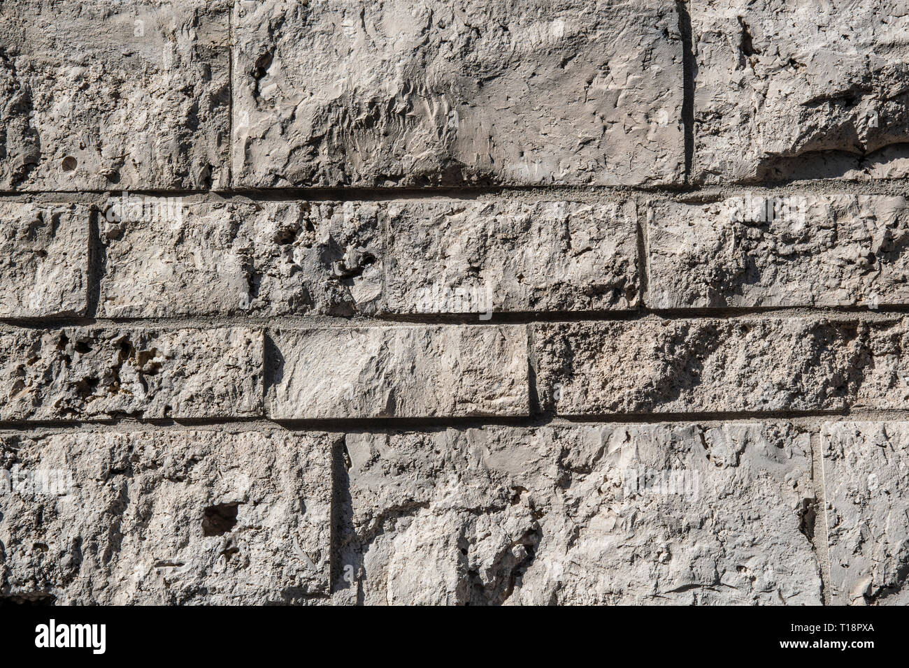 a wall of rough stone blocks as a concrete background Stock Photo - Alamy