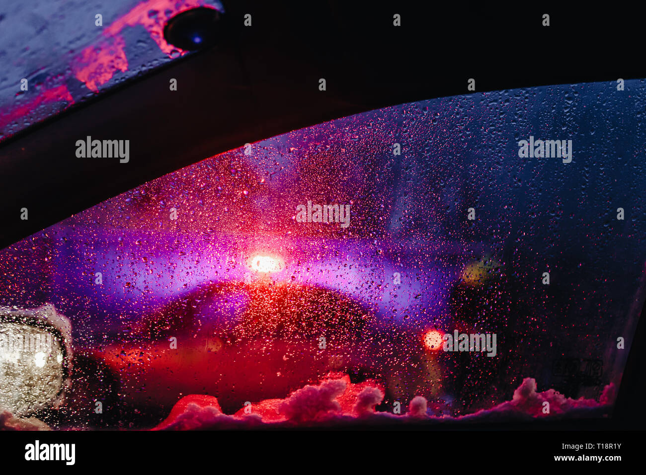 Night city lights through windshield abstract background water drop on ...