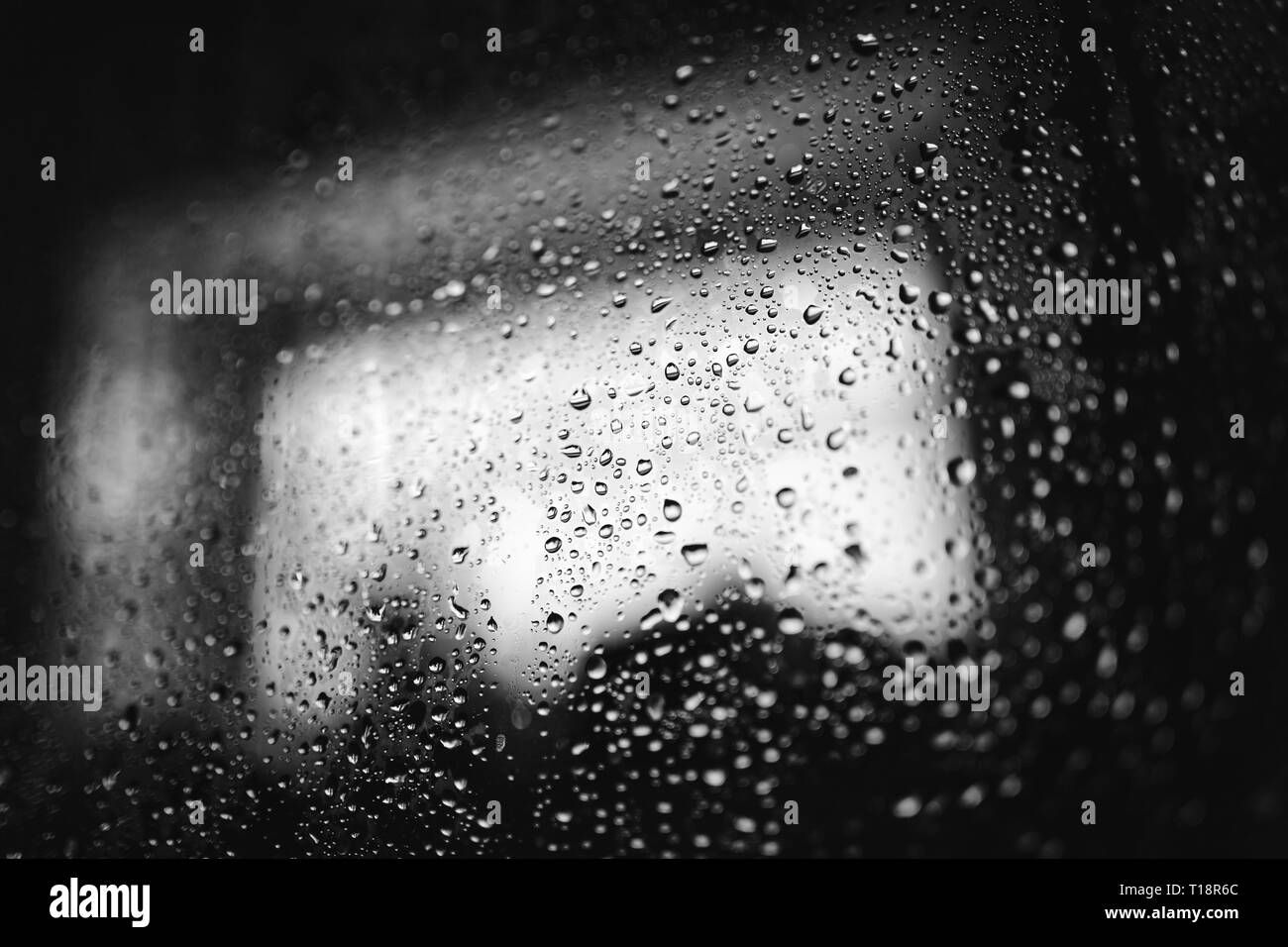 Closeup of condensation patterns on glass window, water droplets with ...