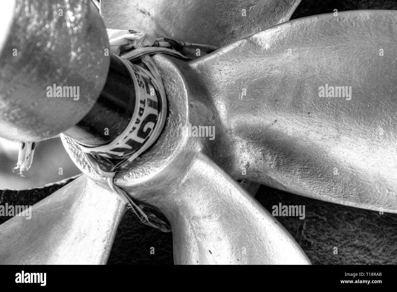 Close up of central part of ship's propeller in black and white while ...
