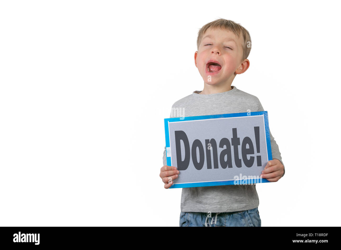 Donation concept - boy holding board with Donate on it Stock Photo - Alamy