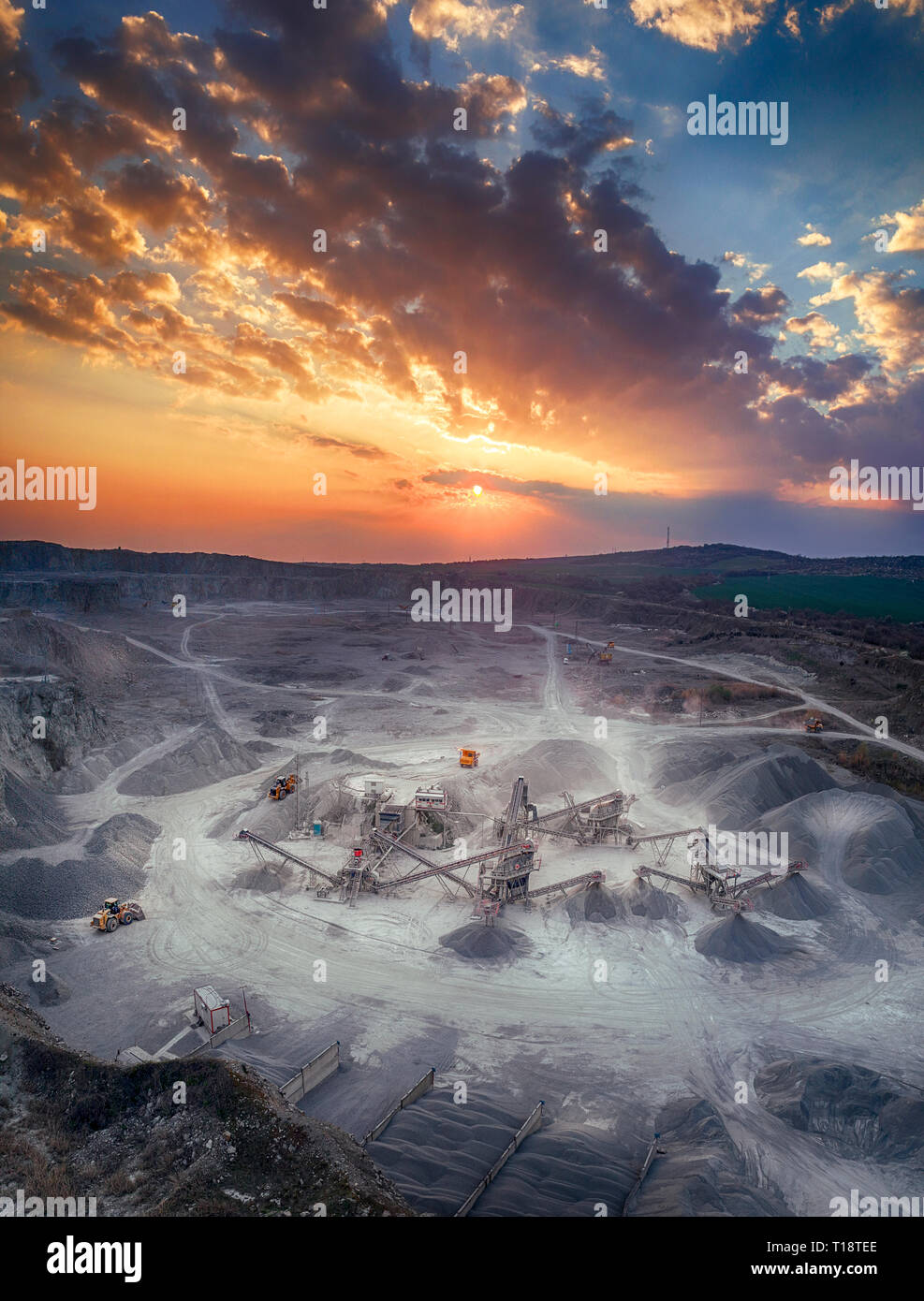 Panoramic view at sunset of gravel quarry, mining of yellow ...