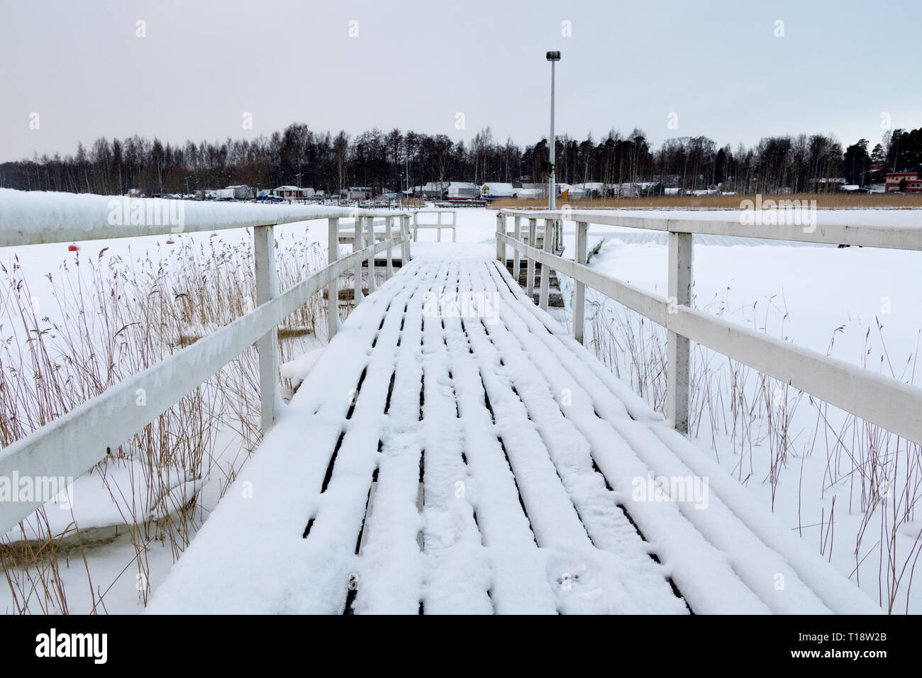 White snowy footbridge in frozen water Stock Photo - Alamy