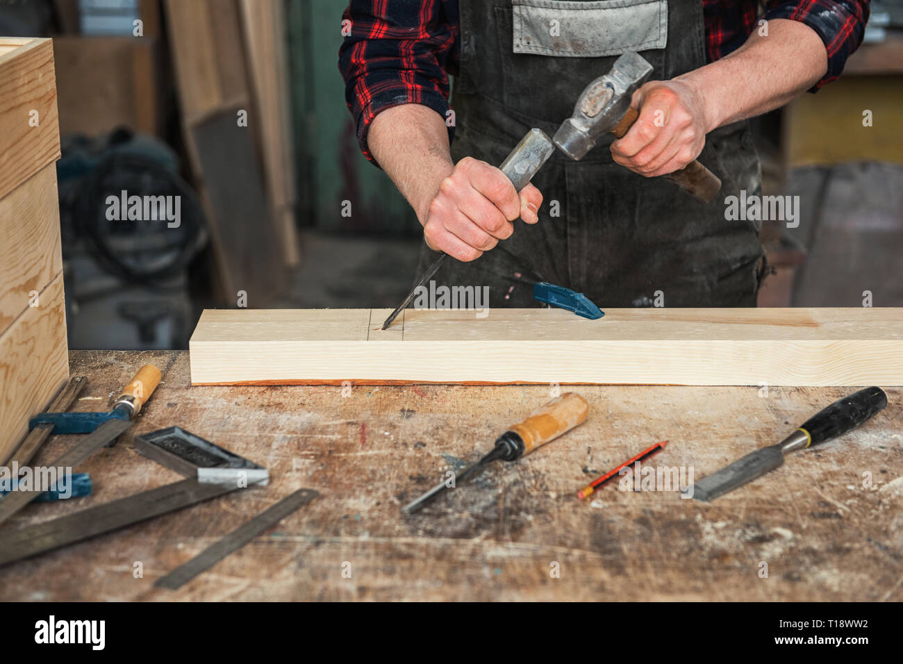 Carpenter working with a chisel Stock Photo - Alamy