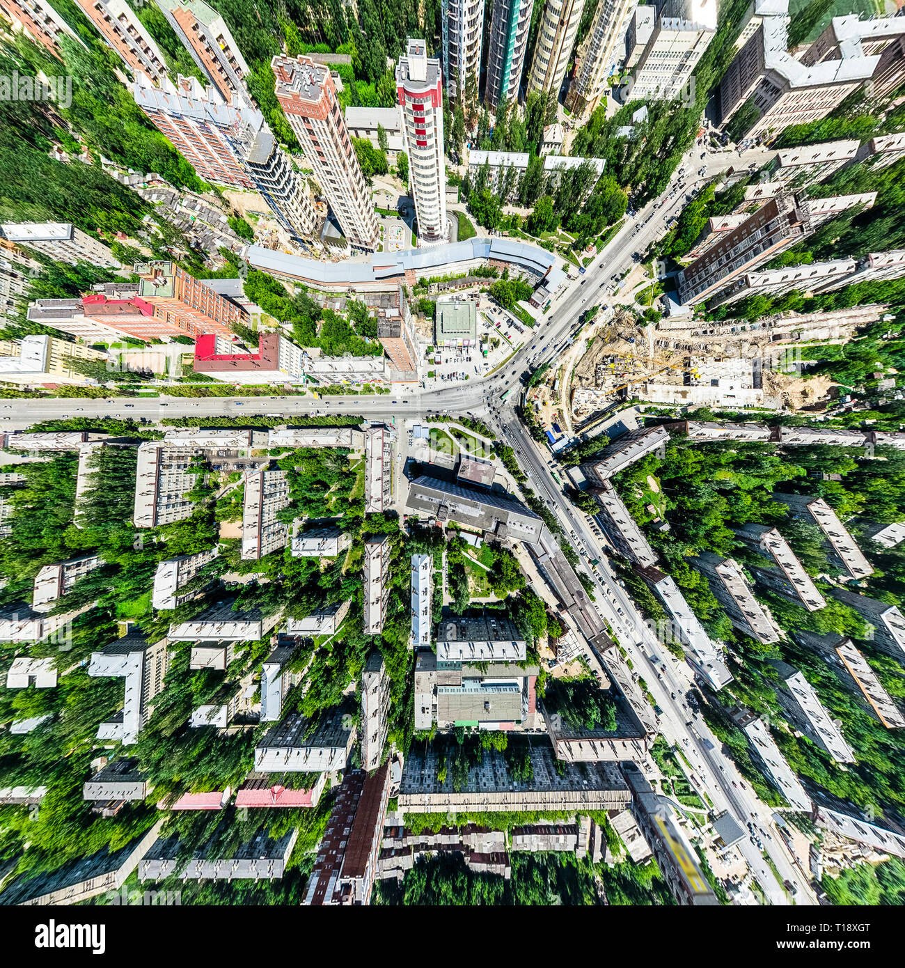 Aerial city view with crossroads and roads, houses, buildings, parks ...