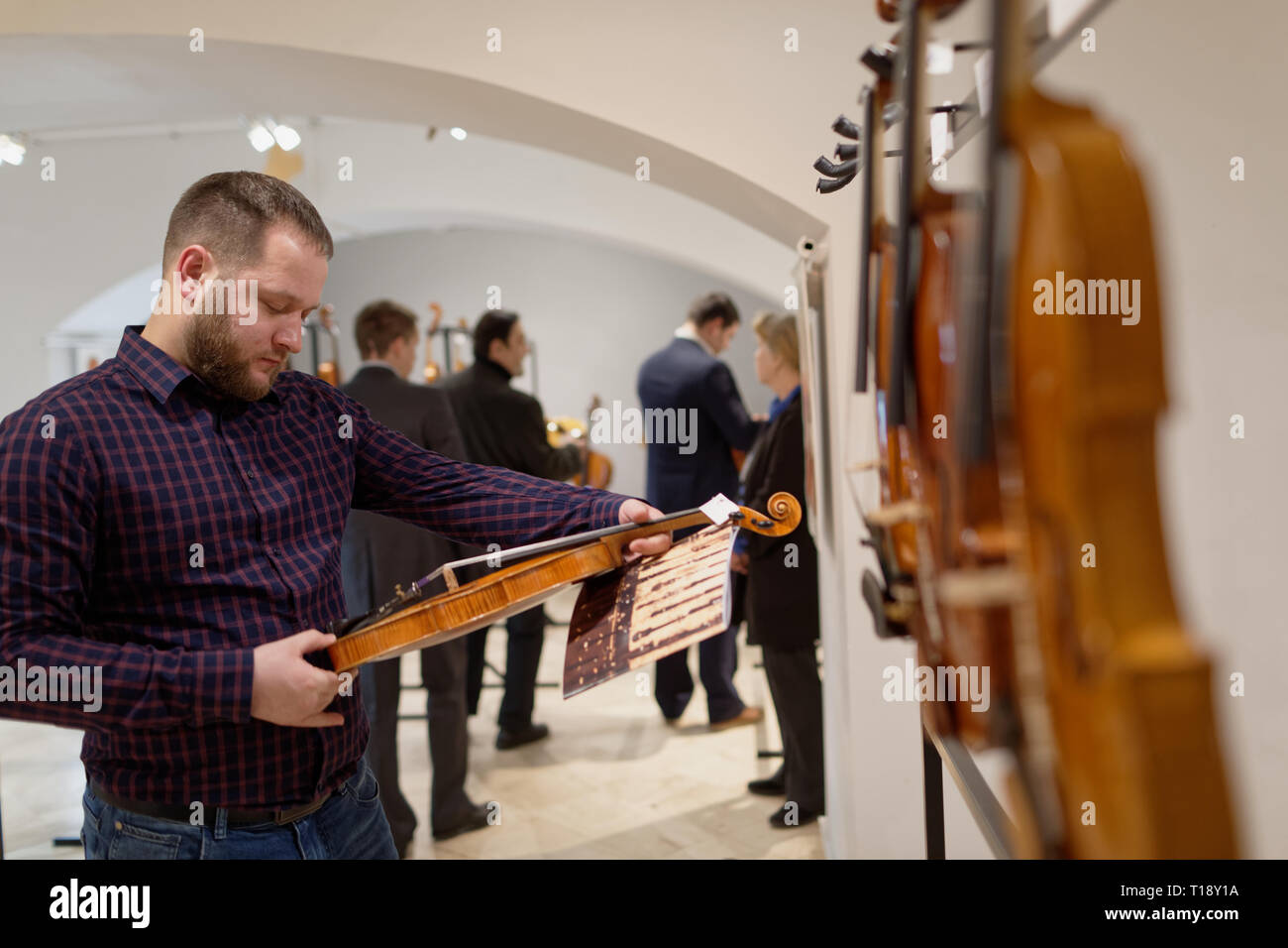 St. Petersburg, Russia - March 18, 2019: People at musical instruments ...