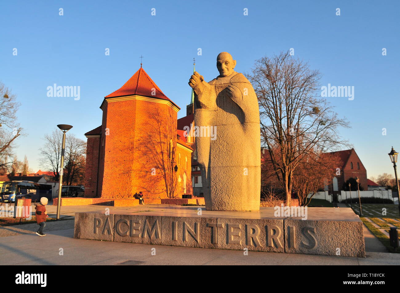 Pope John XXIII Granite Statue with Roman Catholic church of St. Marcin ...
