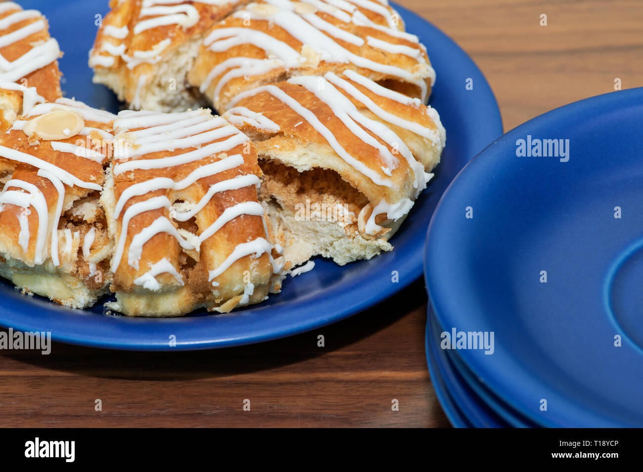 Sweets from a bakery and dessert plates on a conference room table at a ...
