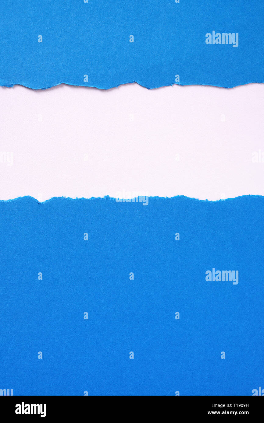 Torn blue paper strip untidy edge border frame vertical Stock Photo - Alamy