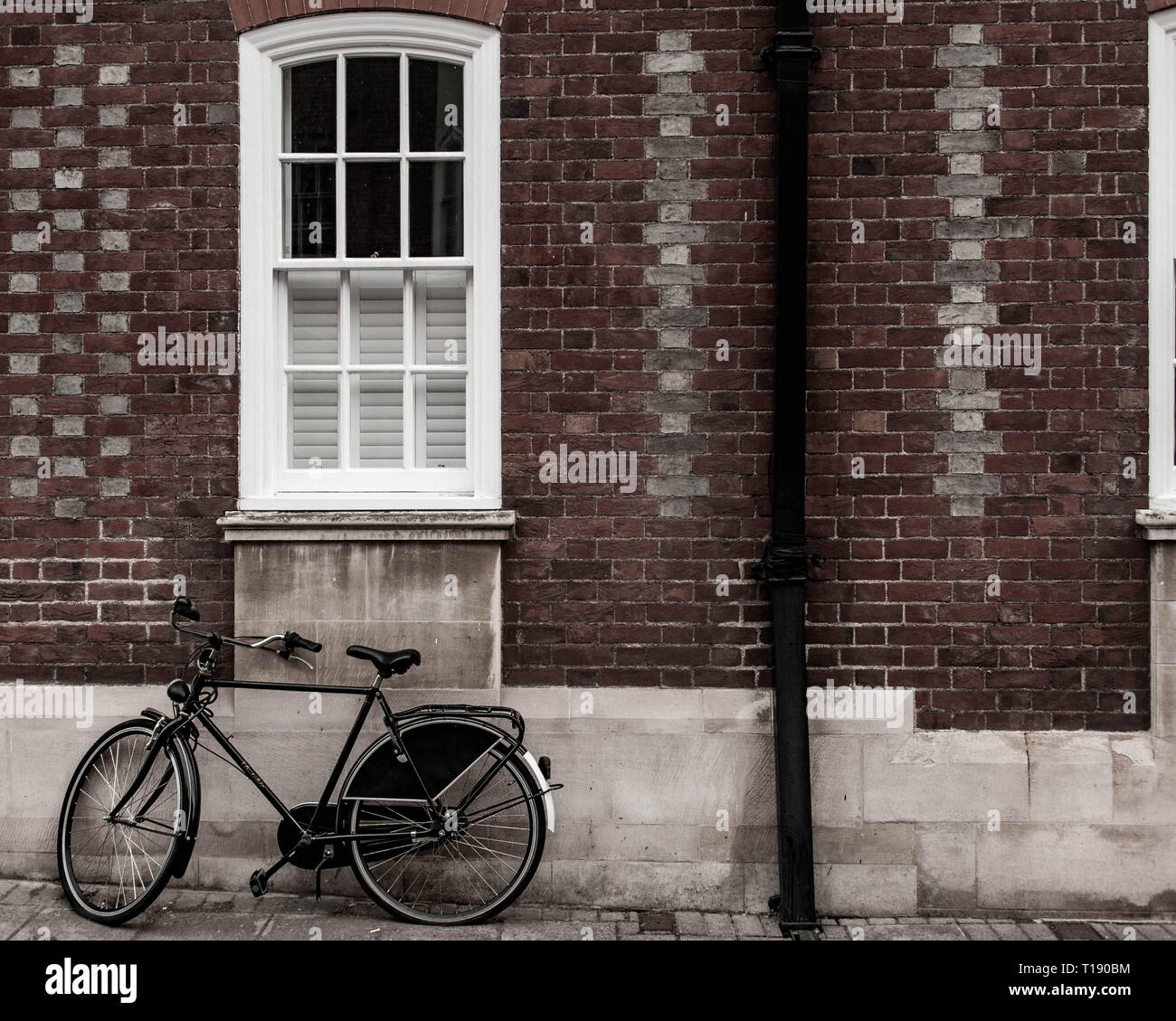 Bike in front of brick wall Stock Photo - Alamy