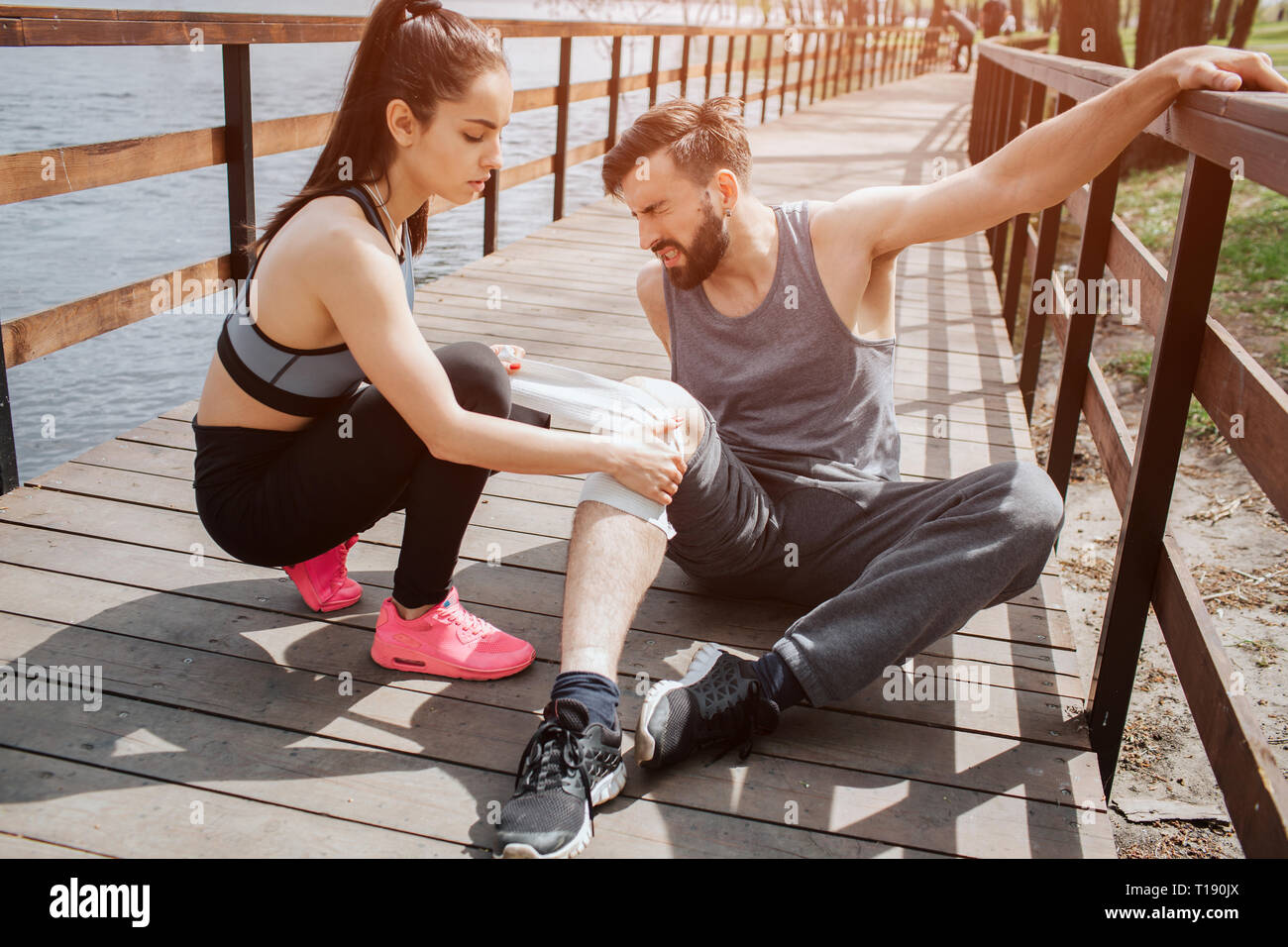 Hand on knee man woman hi-res stock photography and images - Alamy