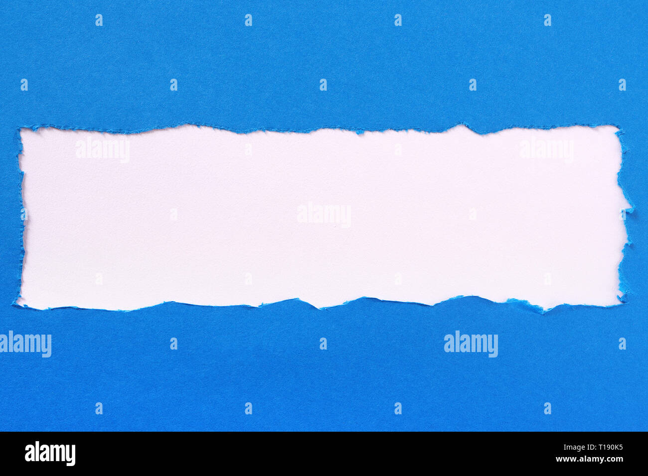 Torn blue paper strip edge border frame center Stock Photo - Alamy