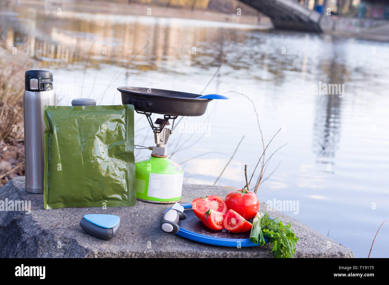 Camping. Rest and eating at the river Stock Photo - Alamy