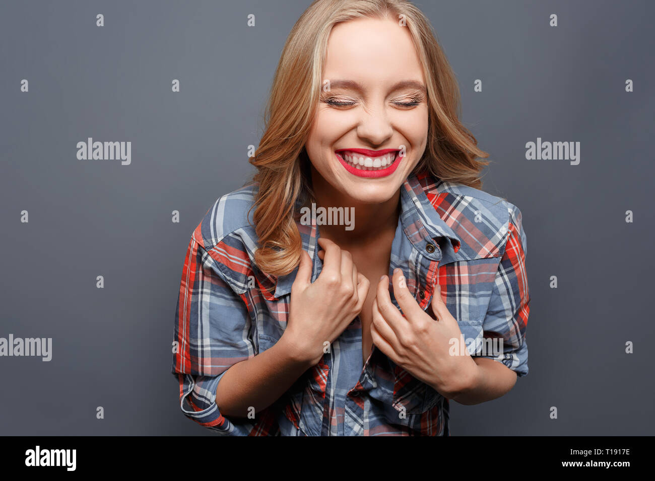 Nice and pretty young woman is laughing. She has closed her eyes. Girl ...