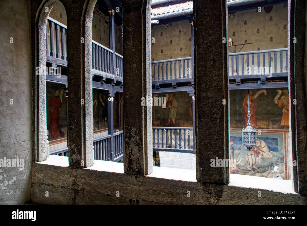 Medieval wooden gallery of the second floor in an old stone castle ...