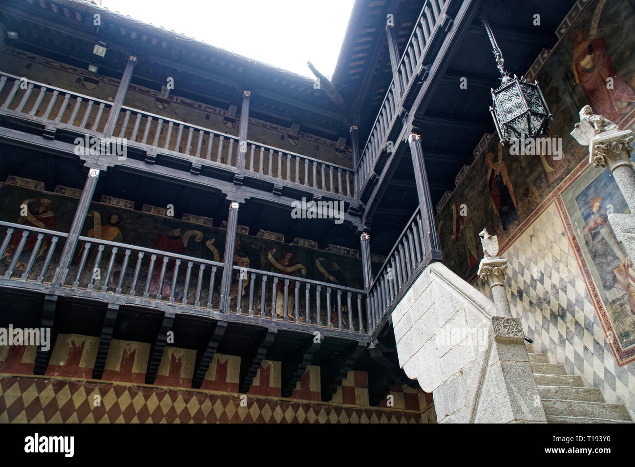 Medieval wooden gallery of the second floor in an old stone castle ...