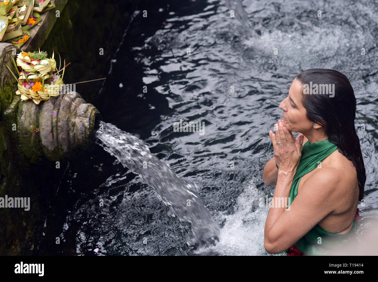 BALI - INDONESIA / 06.06.2018: Tourist woman in holy spring water of ...