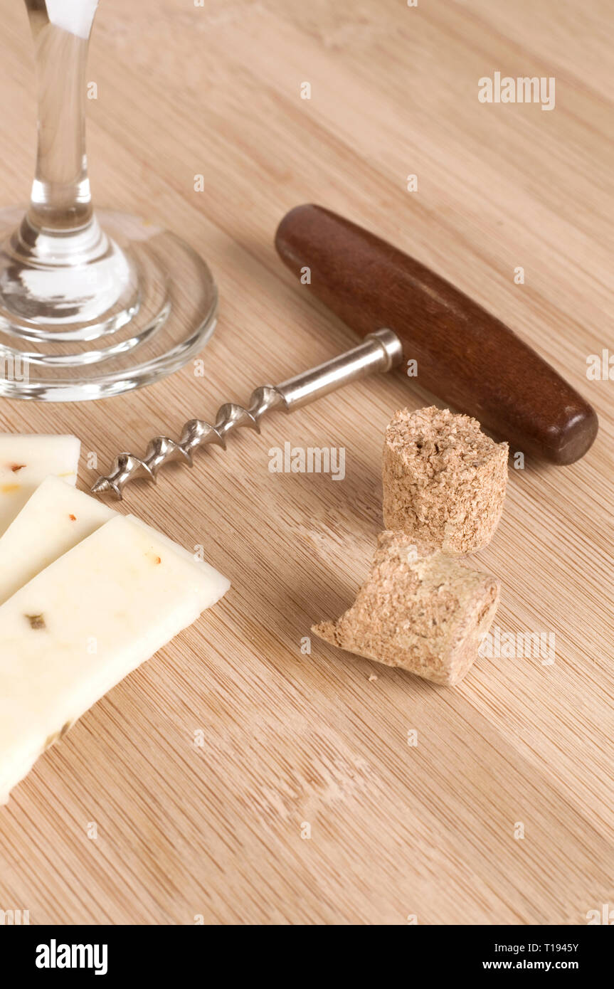 Broken Cork with Vintage Cork Screw and Cheese Slices Stock Photo - Alamy
